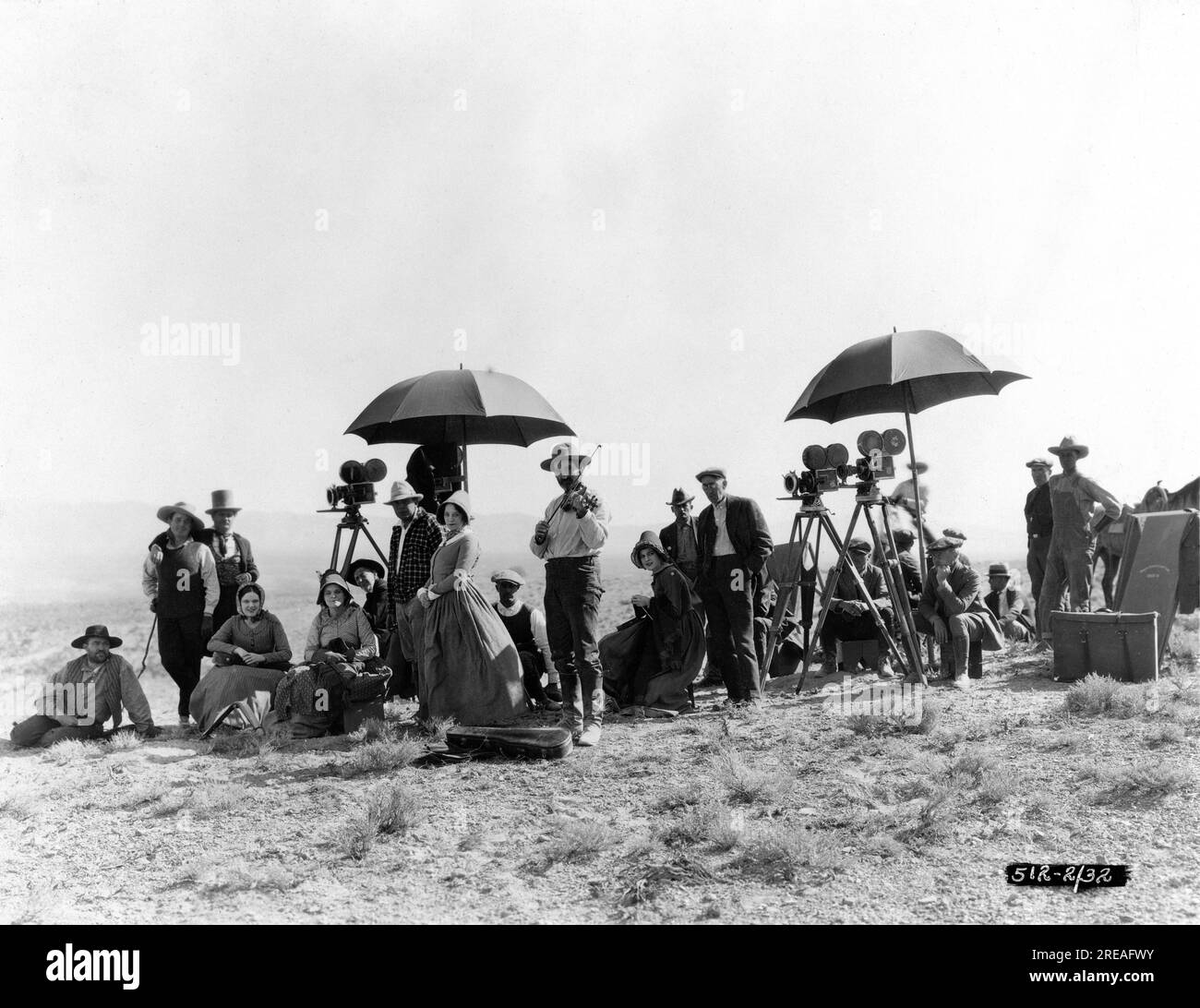ALAN HALE (3rd from left) Director JAMES CRUZE (in checked jacket near ...