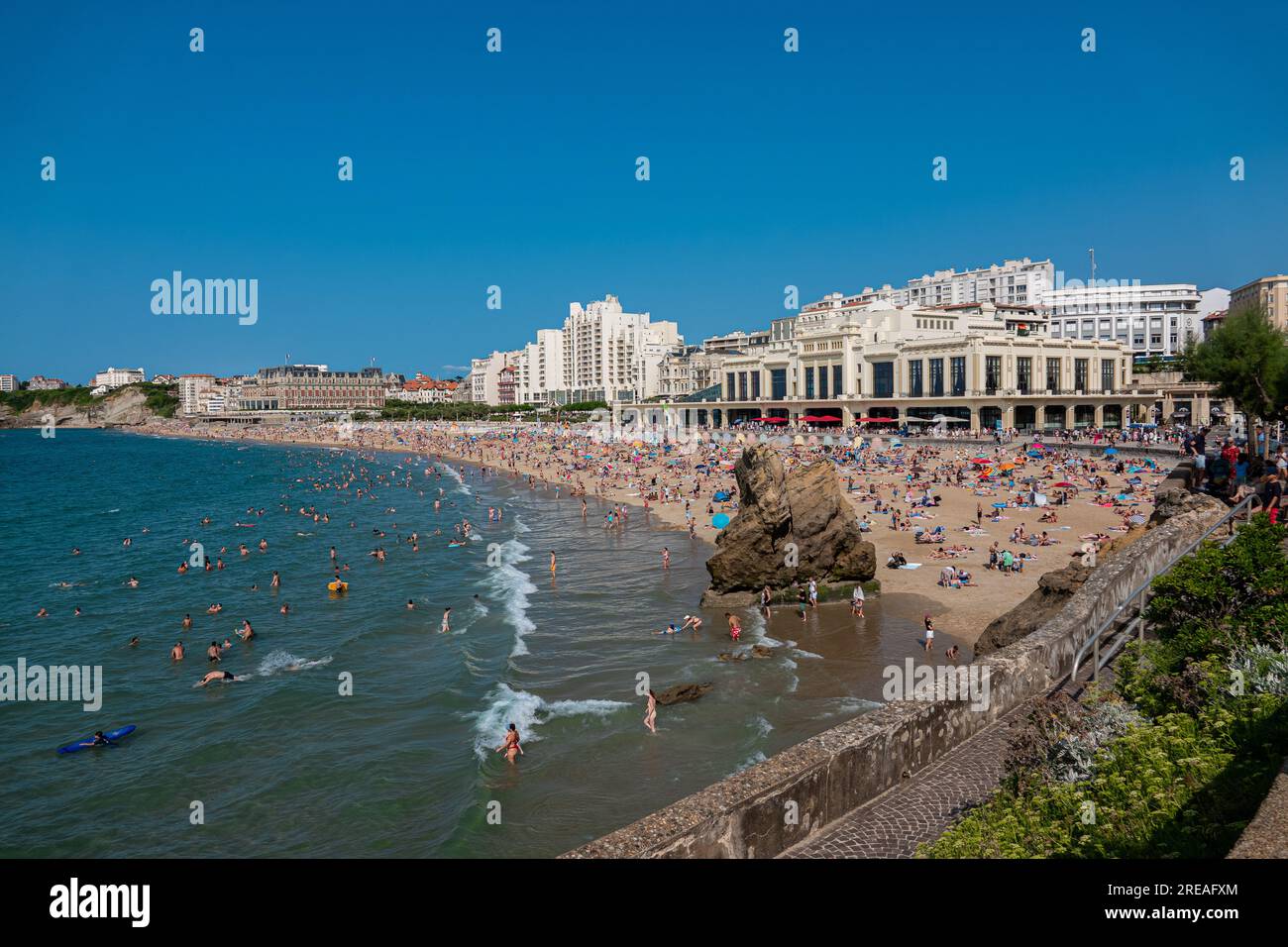 Biarritz beach full of people bathing and sunbathing on a summer ...