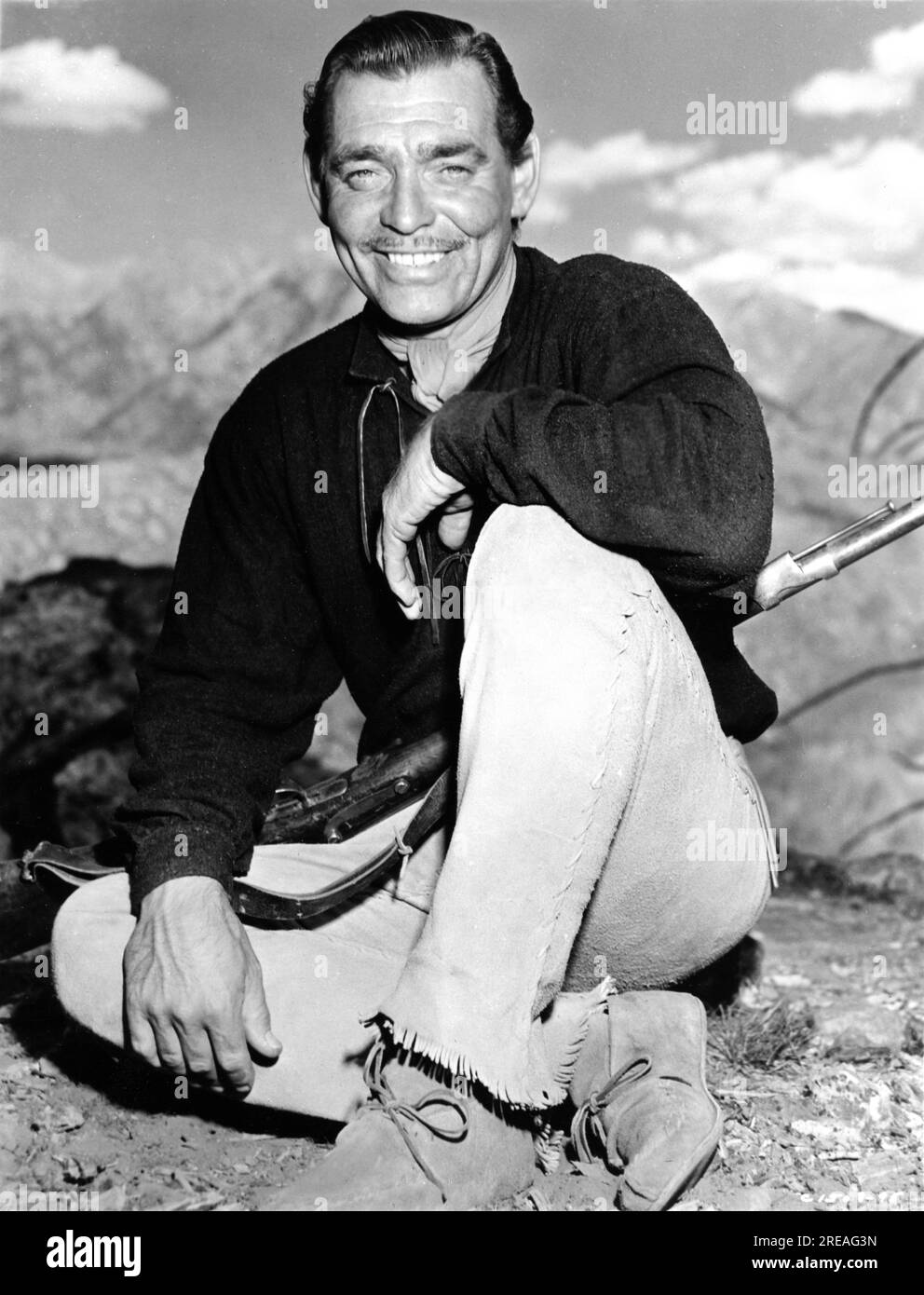 CLARK GABLE on set location candid in Colorado during filming of ACROSS ...