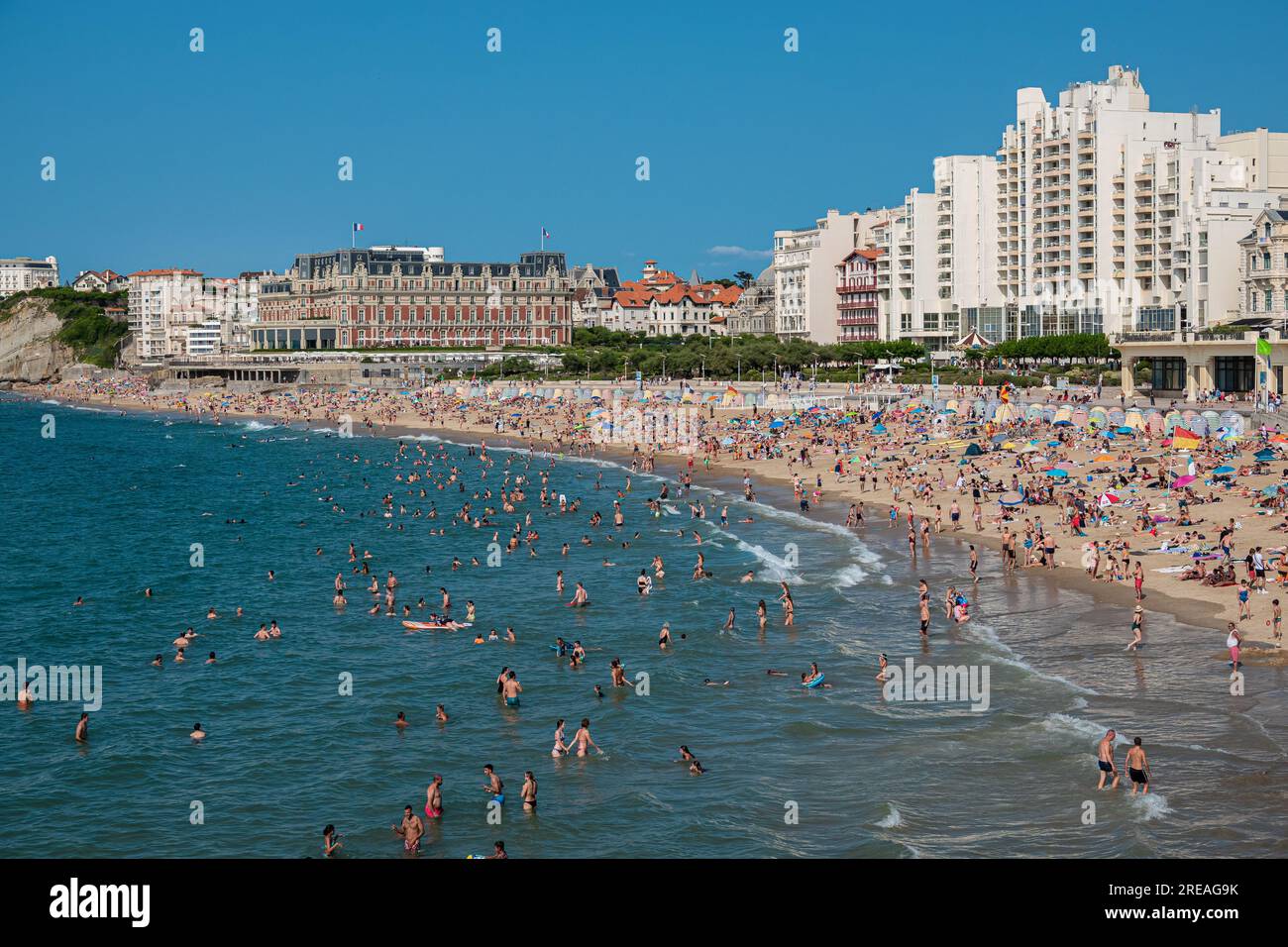Biarritz beach full of people bathing and sunbathing on a summer ...
