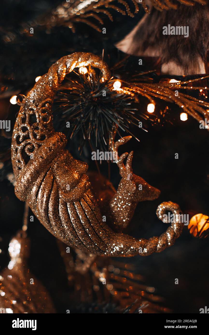 Vintage Christmas golden decor moon hanging on the Christmas tree ...