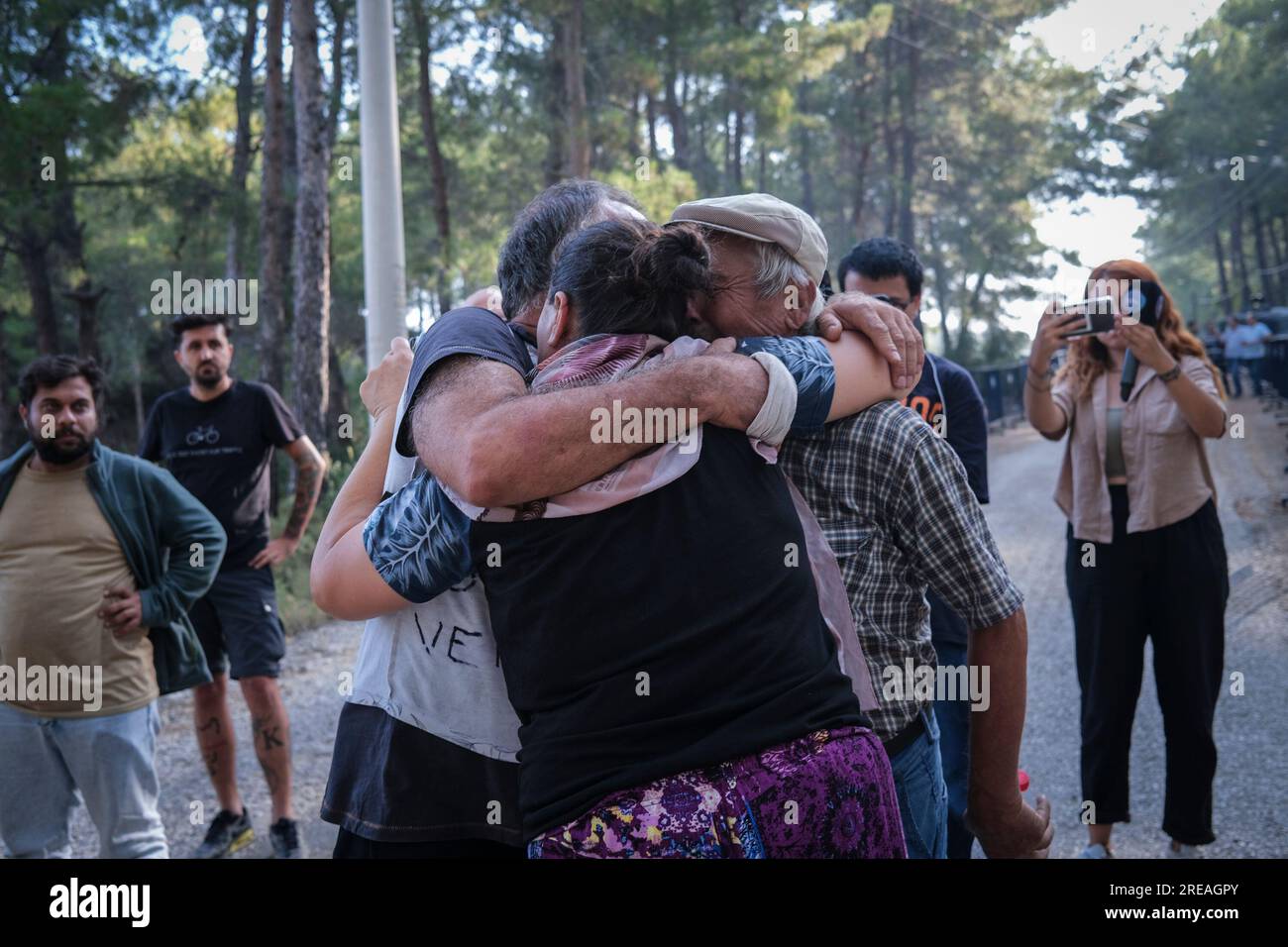 Izmir, Turkey. 26th July, 2023. Villagers hug each other. Villagers in ...