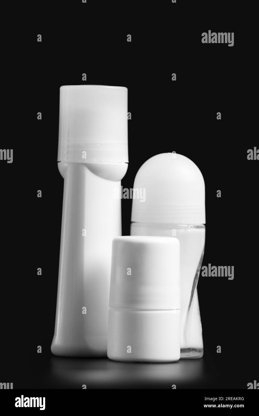 Set of white antiperspirant deodorant roll-on, isolated on black ...