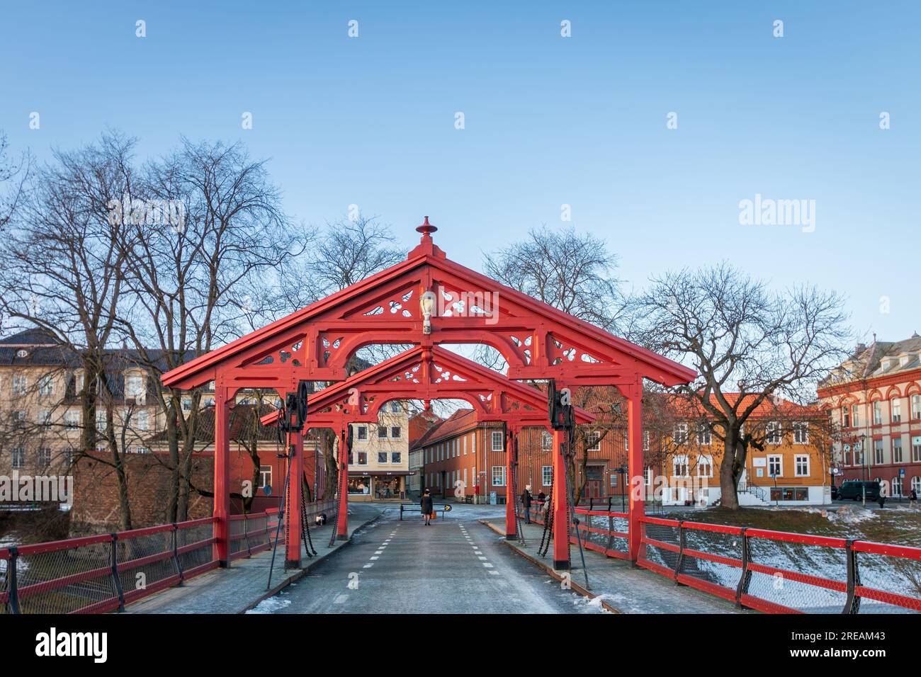 The Old Town Bridge or Gamle Bybro of Trondheim crossing the Nidelva River, Norway in winter ...