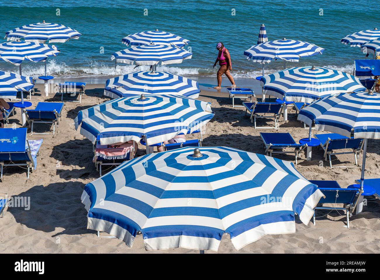 The beach in Cefalù on a sunny day in July. Historic Cefalù is a major ...