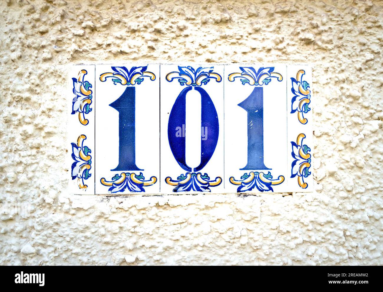Number 101, one hundred and one, blue numerals on tiles on a pale ...