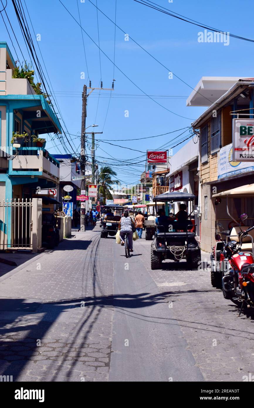 Middle Street in San Pedro Town, with shops, restaurants, golf carts ...