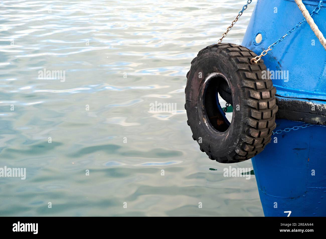 A tyre fender on the bow of a small harbor tug boat Stock Photo - Alamy