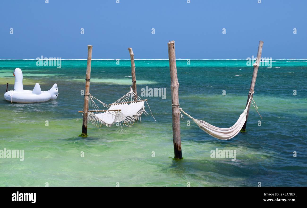 Hammocks and pool floats over the Caribbean Sea, within the Belize ...