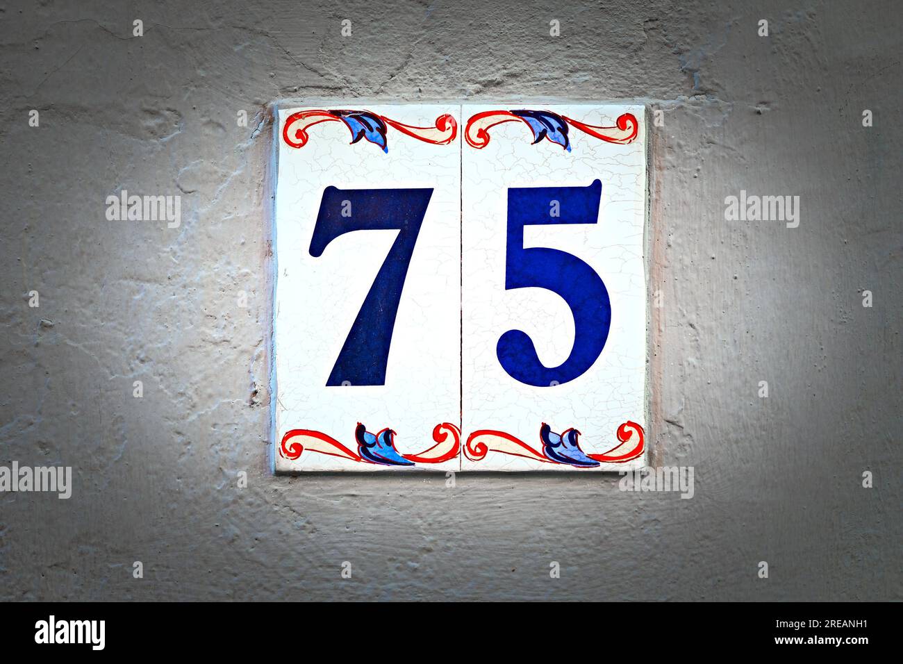 75, number seventy-five, blue digits on floral tiles, vignetted Stock ...