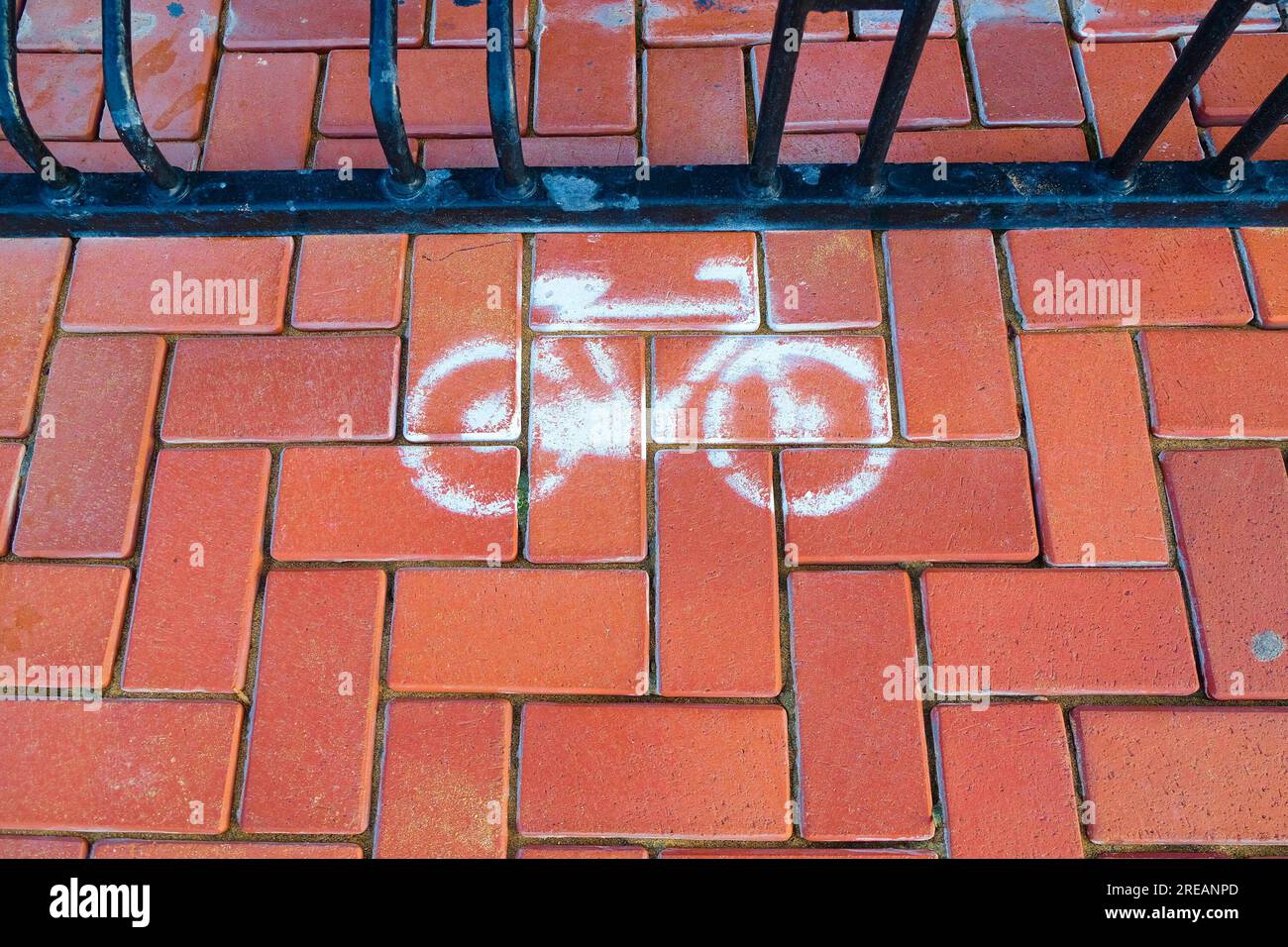 A bike rack and a bike parking sign Stock Photo - Alamy