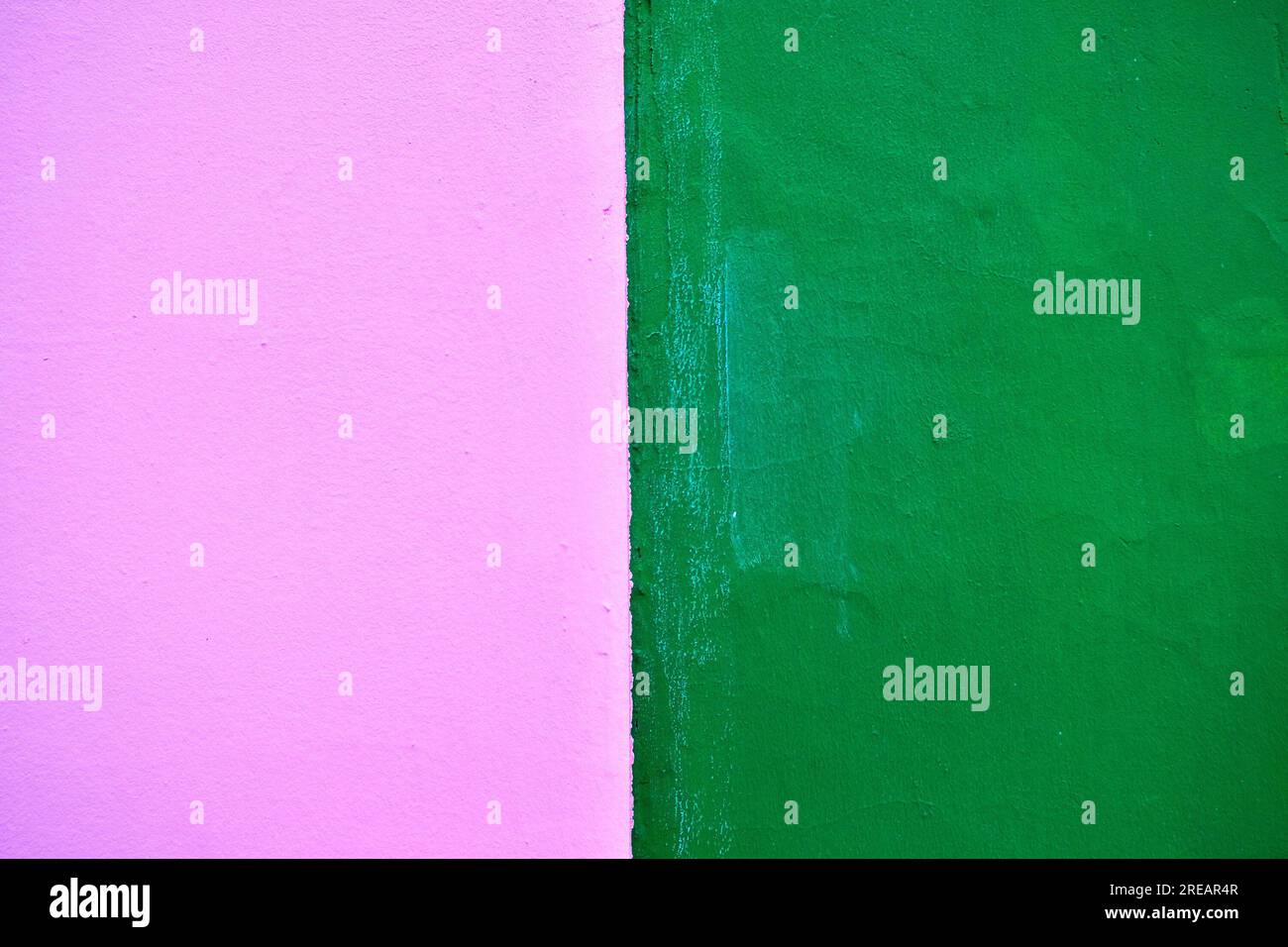Two color painted background in pink and green Stock Photo - Alamy