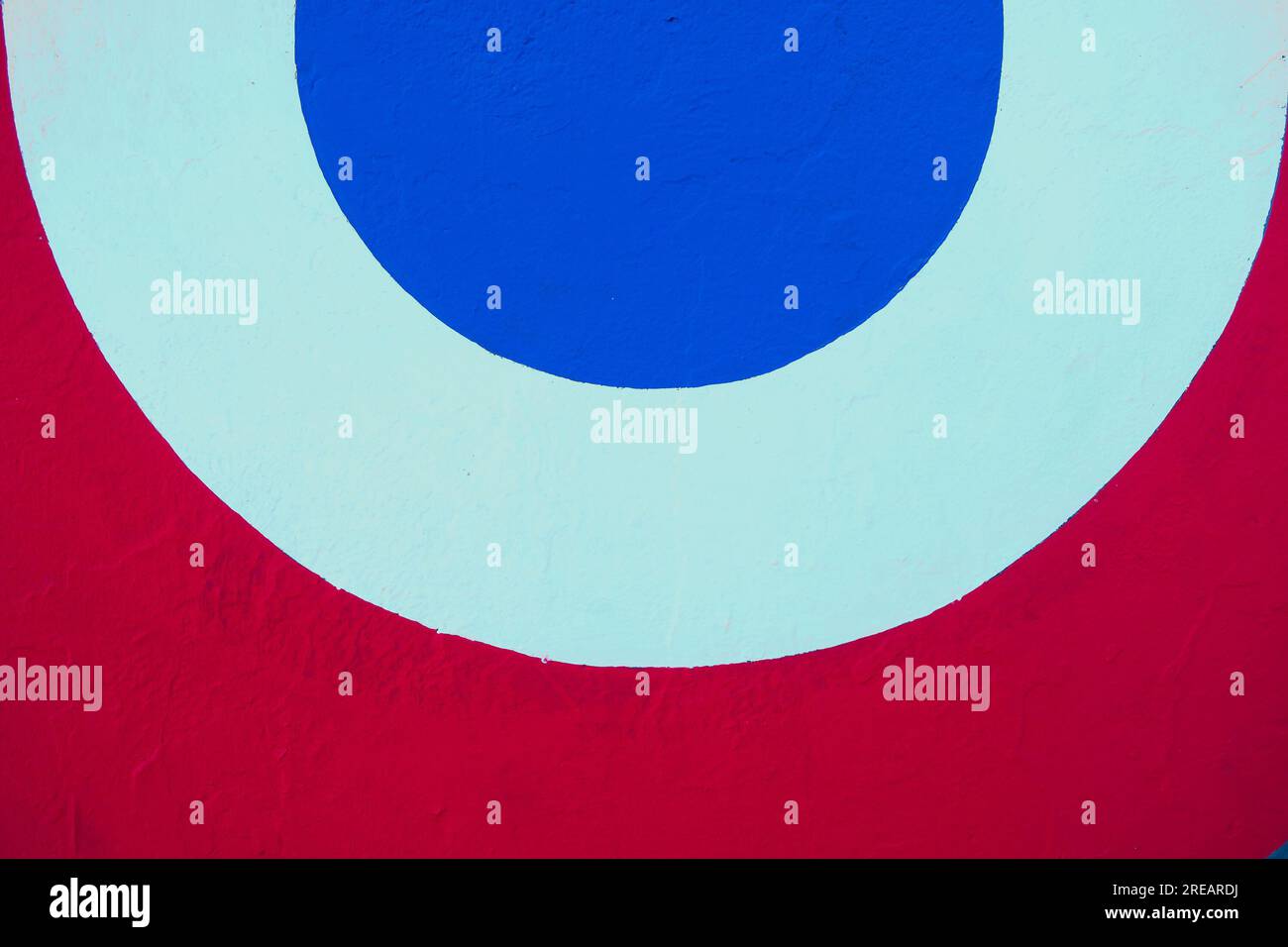 Red, white, blue, circular design pattern with colorful semicircles ...