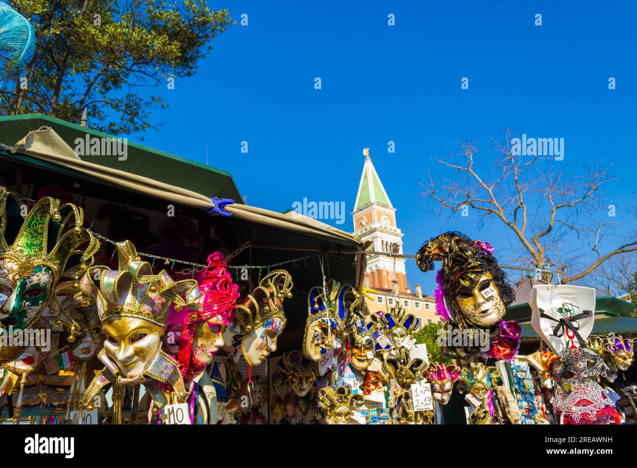 Beautiful carnival masks and gifts at kiosk displayed on vendor stand ...