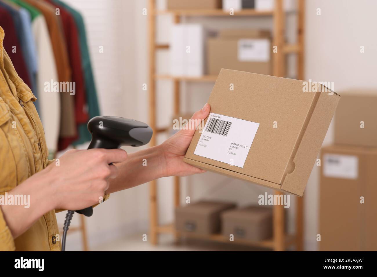 Woman scanner reading parcel hi-res stock photography and images - Alamy