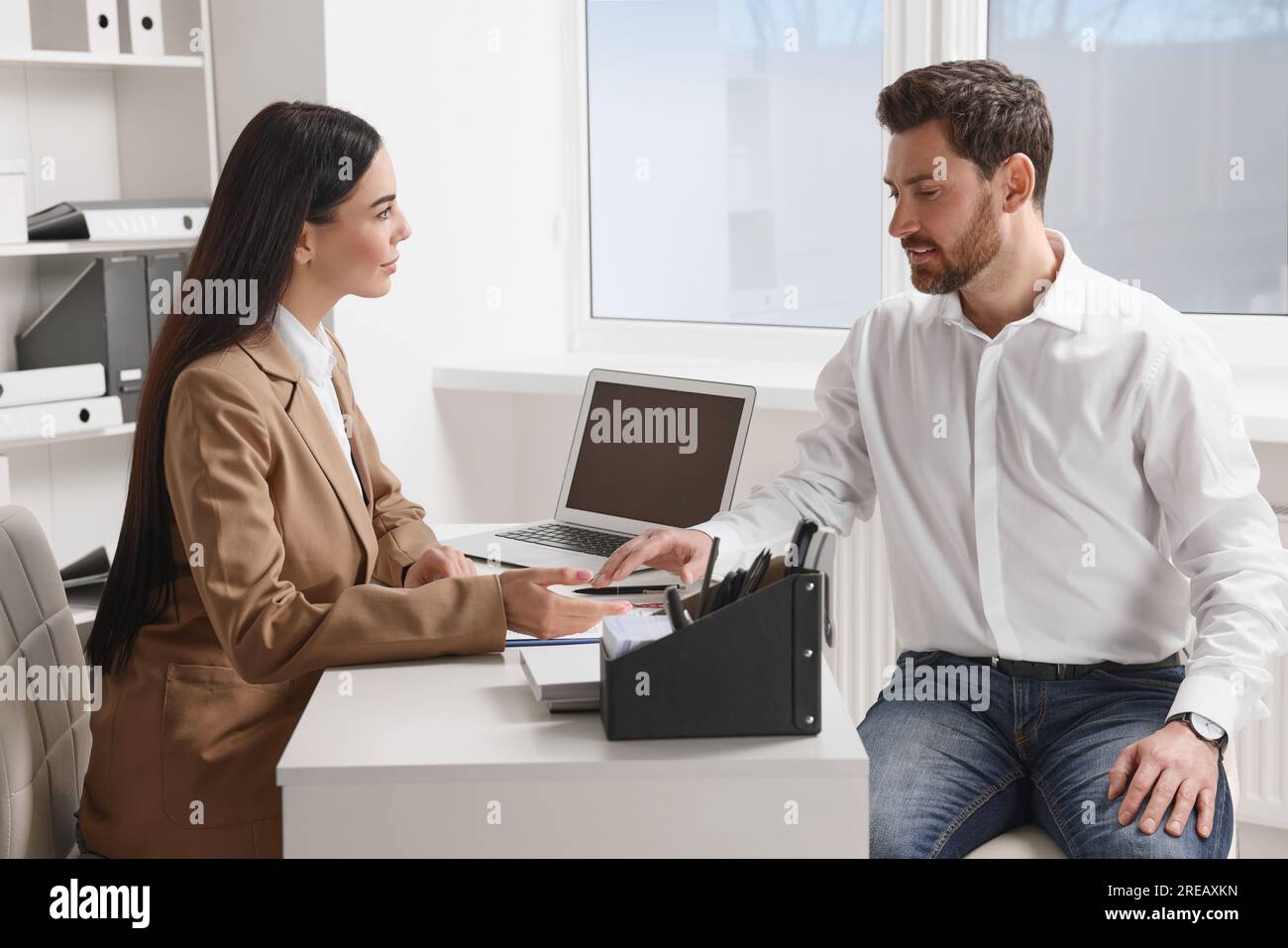 Human resources manager conducting job interview with applicant in office Stock Photo - Alamy