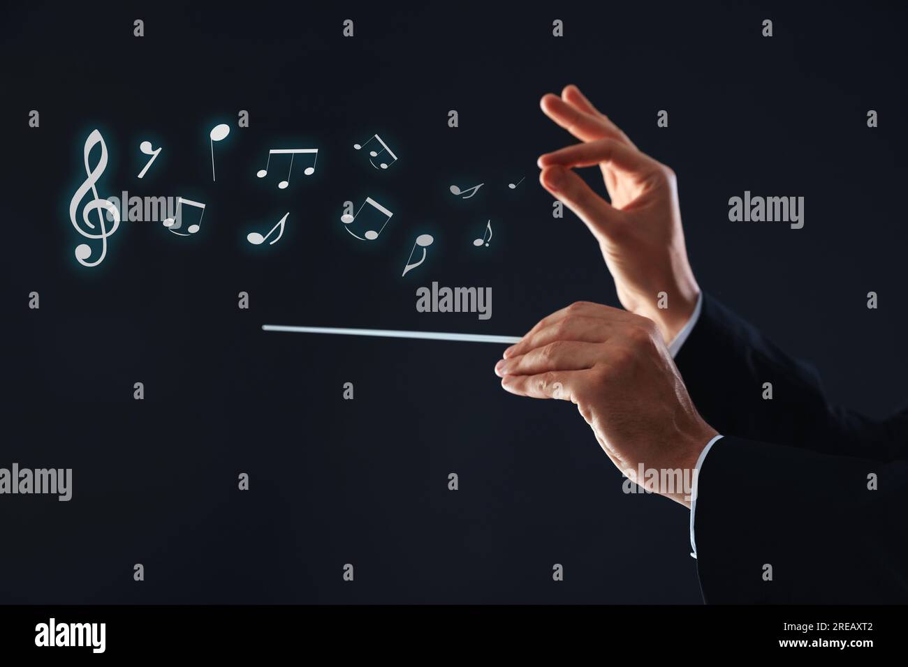 Conductor with baton and music notes on dark background, closeup Stock ...