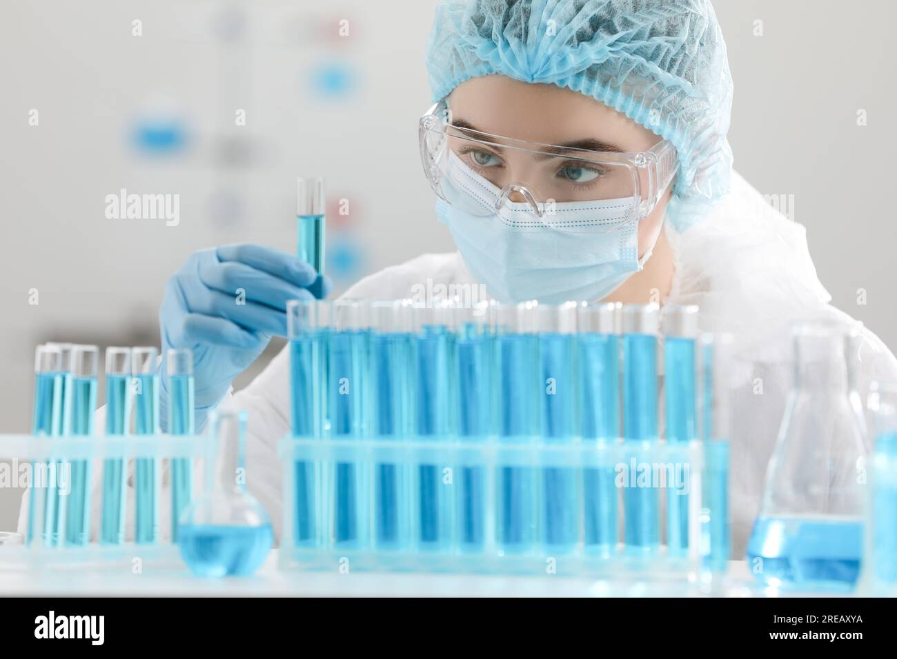 Scientist holding test tube with sample in laboratory Stock Photo - Alamy