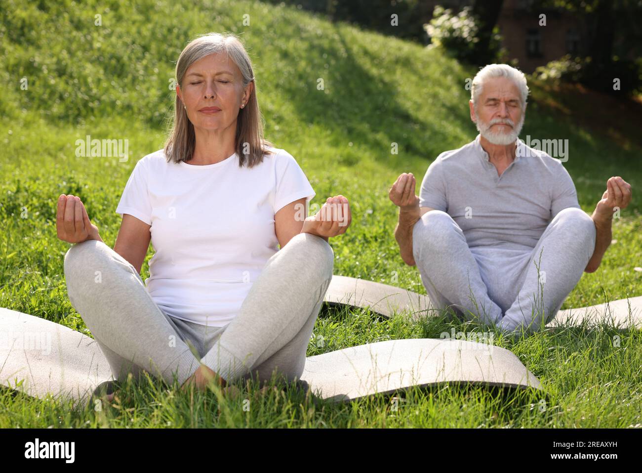 Old woman practicing lotus hi-res stock photography and images - Alamy