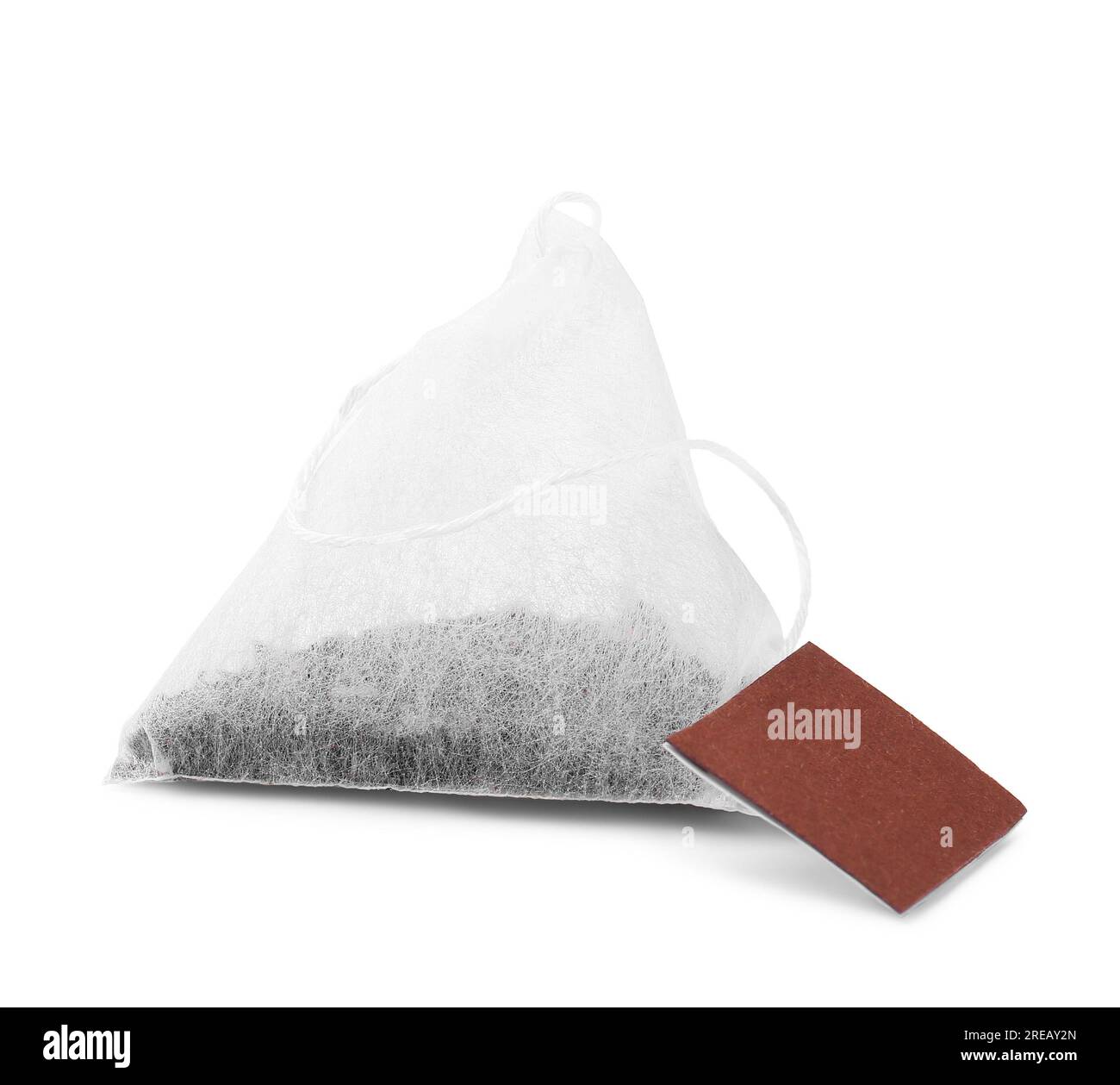 New tea bag with label on white background Stock Photo - Alamy