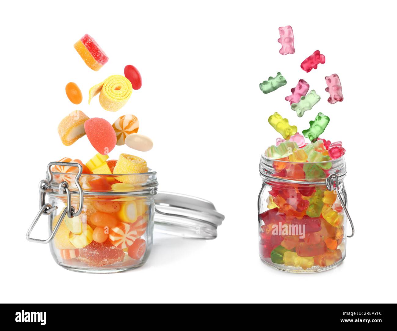 Different yummy candies falling into glass jars on white background ...