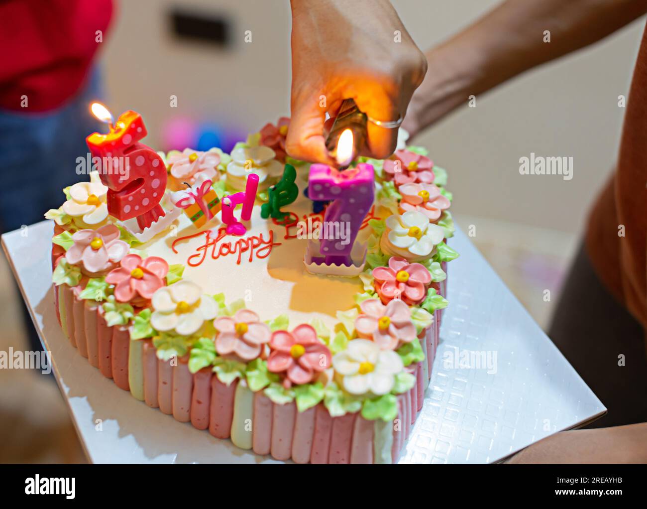 girl's hand holding a birthday cake Focus on the happy moments Stock ...