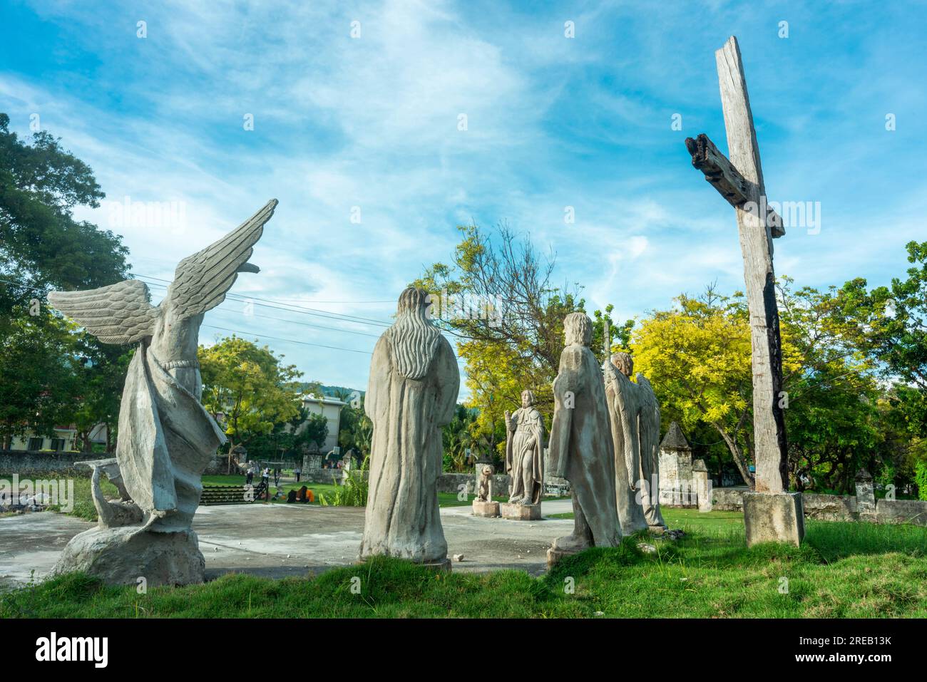 Arranged in a semi circle with crucifix behind,surrounding a concrete ...