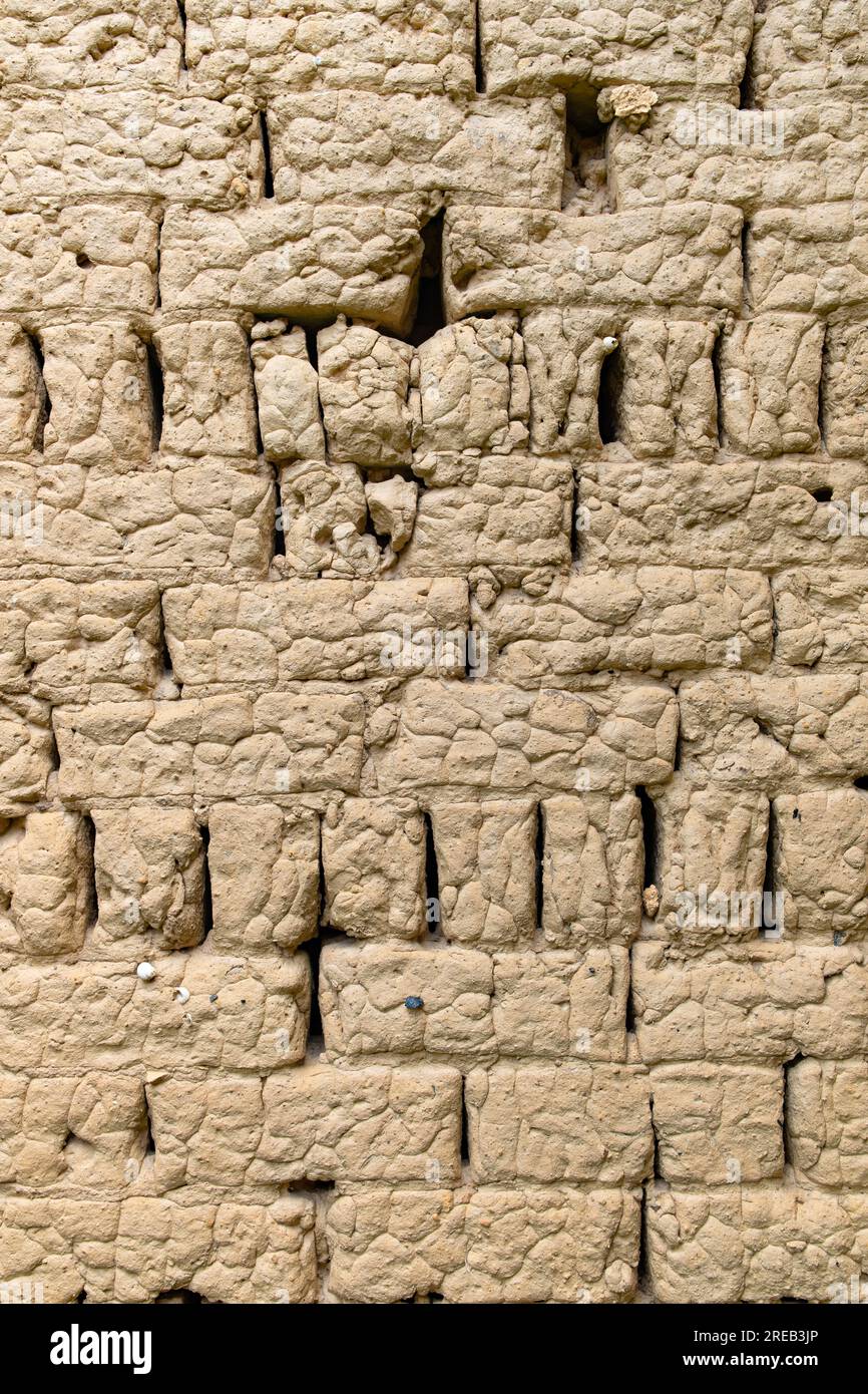 wall made of mud bricks as background and texture vertical Stock Photo ...