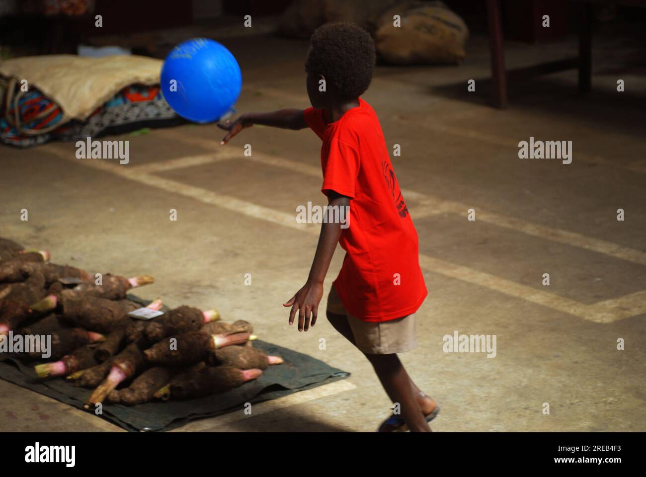 Boy playing with a blue balloon, Port Vila Markets, Port Via, Vanuatu ...