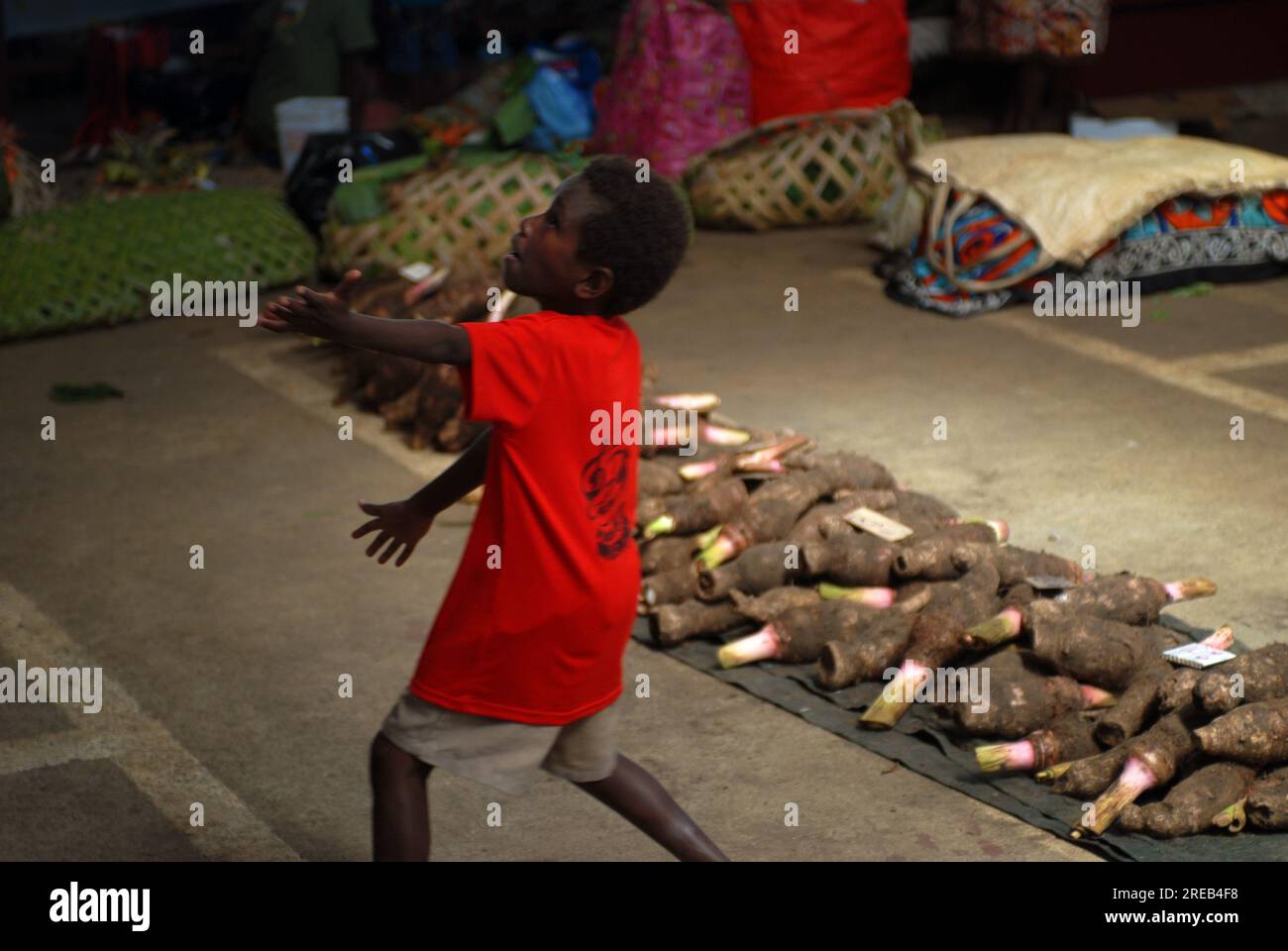 Boy playing with a blue balloon, Port Vila Markets, Port Via, Vanuatu ...