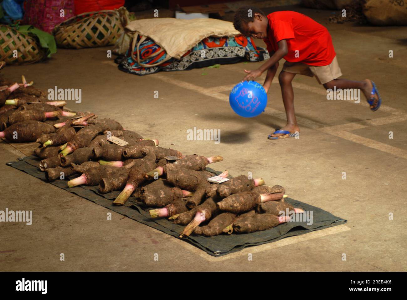 Boy playing with a blue balloon, Port Vila Markets, Port Via, Vanuatu ...