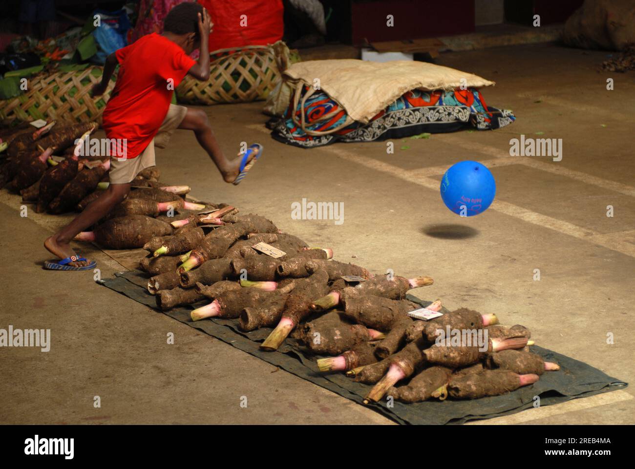 Boy playing with a blue balloon, Port Vila Markets, Port Via, Vanuatu ...