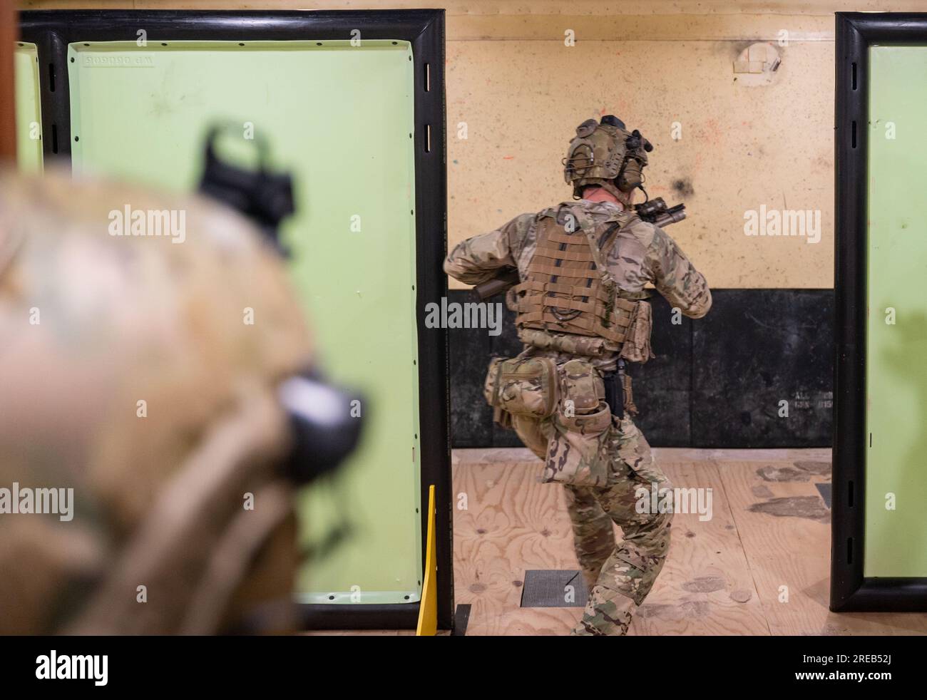 Operators from a U.S. Naval Special Warfare unit clear a room while ...