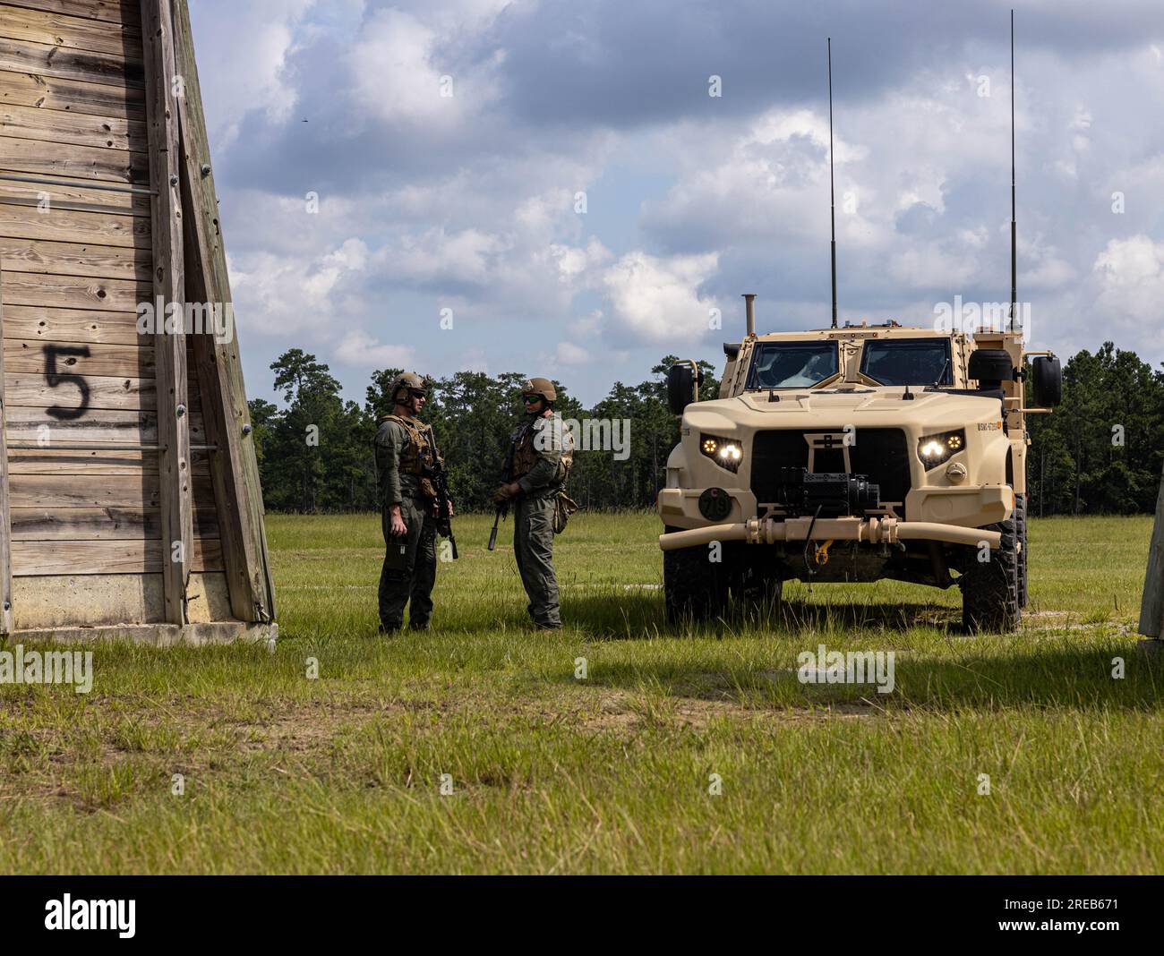 U.S. Marine Corps Sgt. Trevor Evan (left) and Staff Sgt. Dent Hall ...