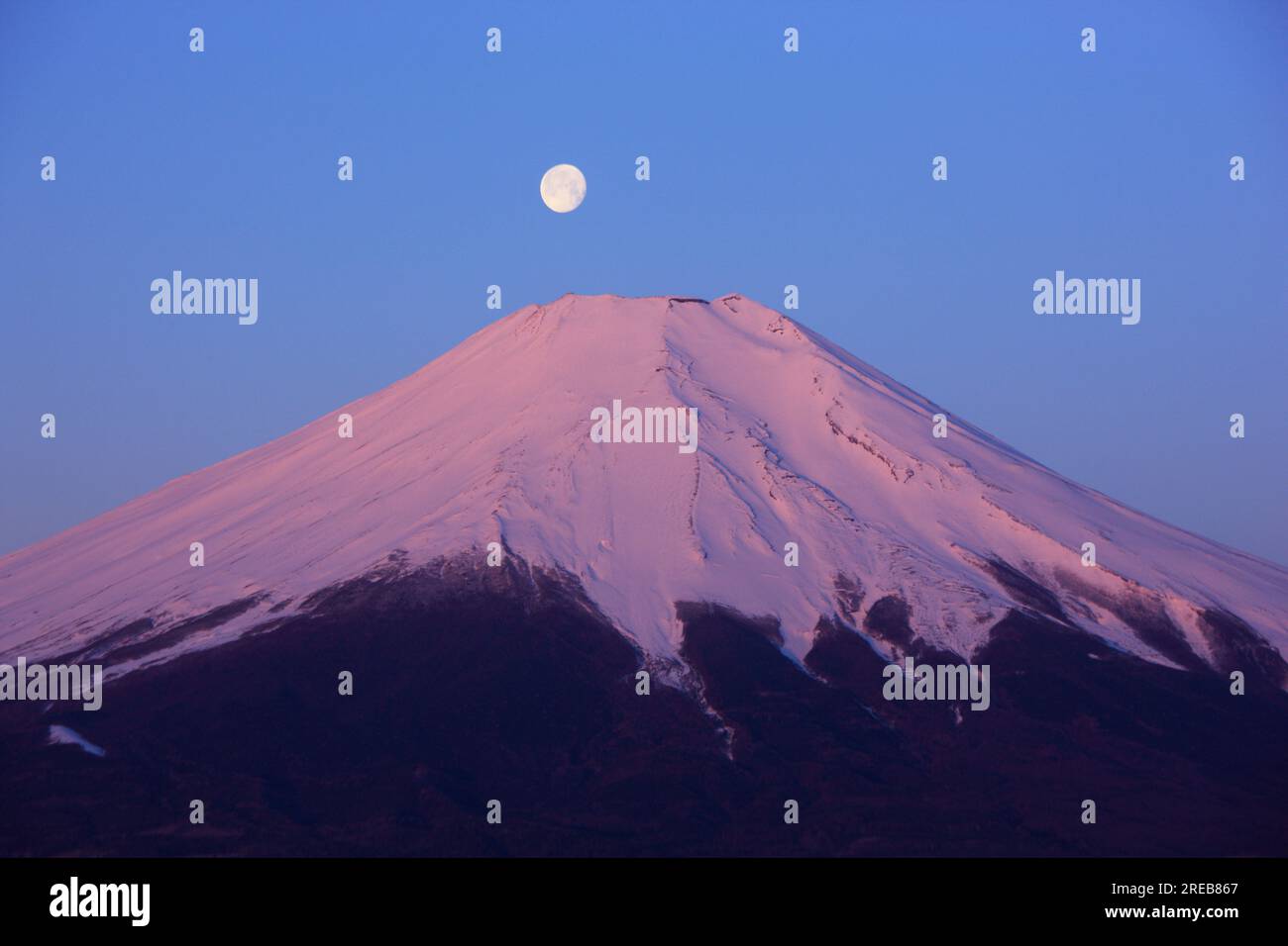 Mt. Fuji and the moon of dawn Stock Photo - Alamy