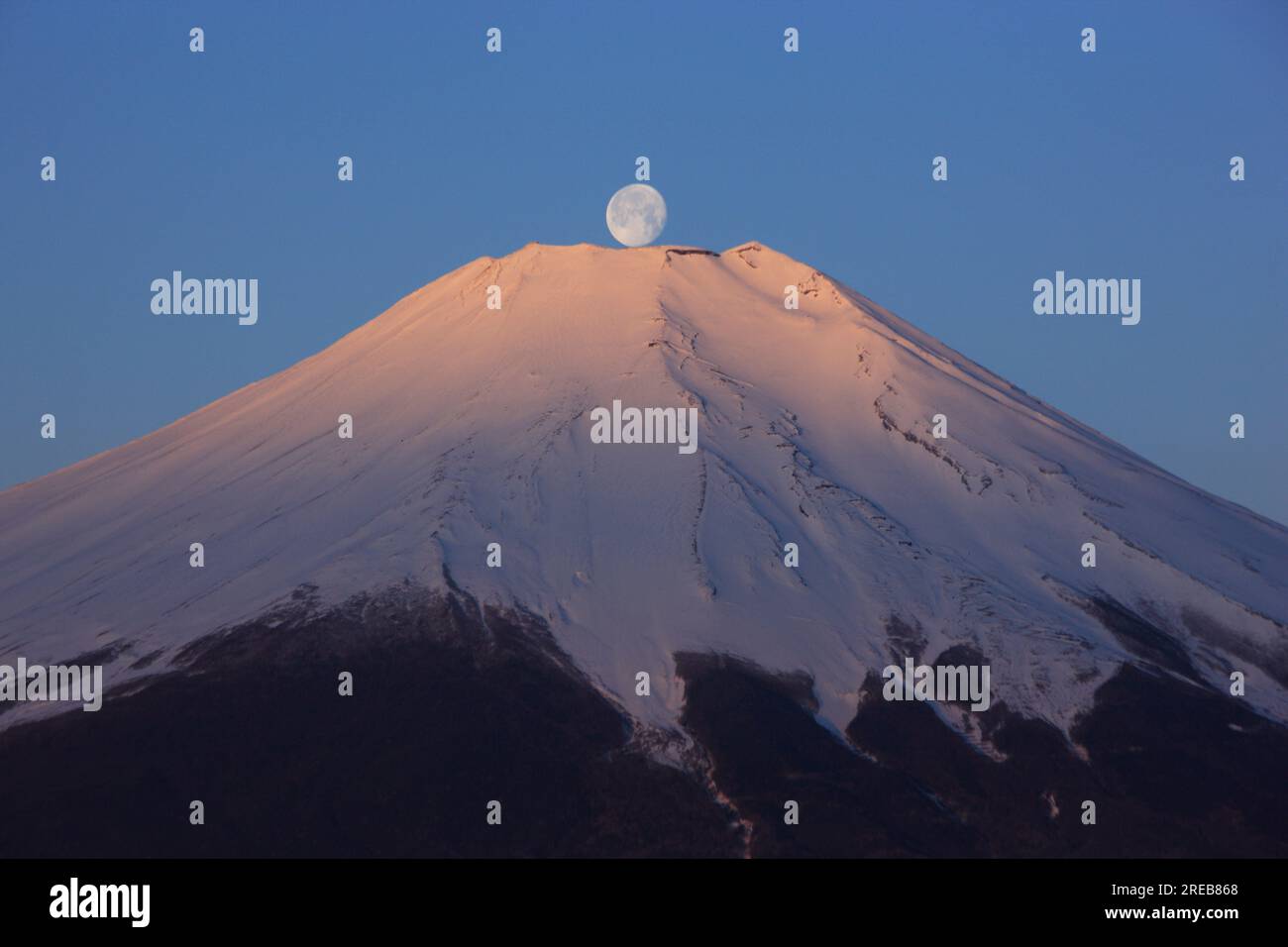 Mt. Fuji and the moon of dawn Stock Photo - Alamy