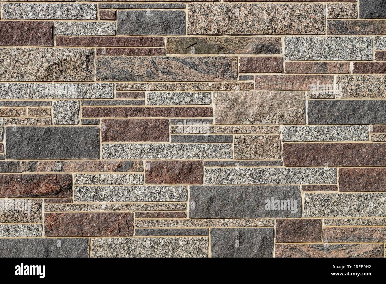Full frame texture background of a modern granite stone wall in ashlar ...