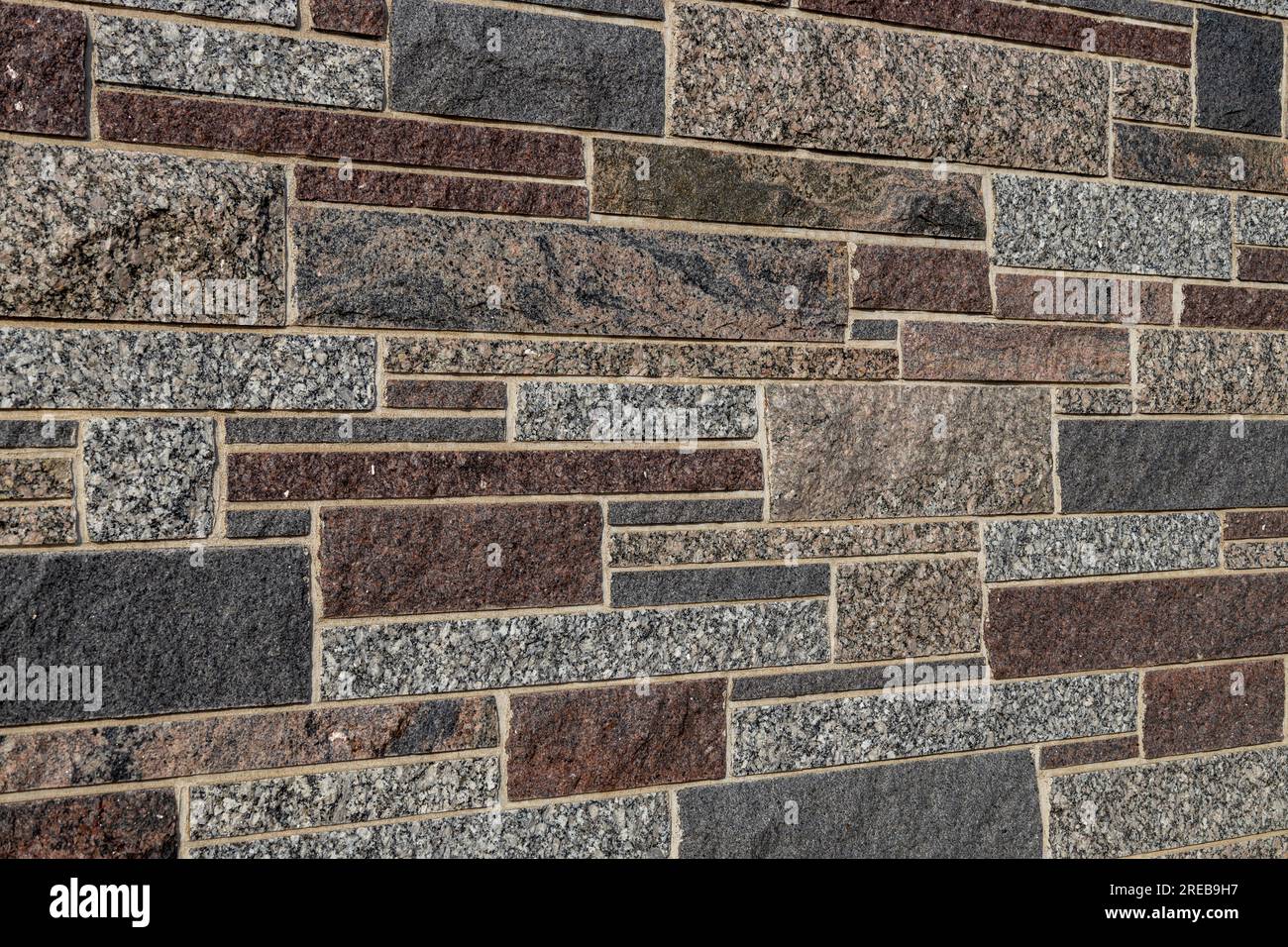 Full frame texture background of a modern granite stone wall in ashlar ...