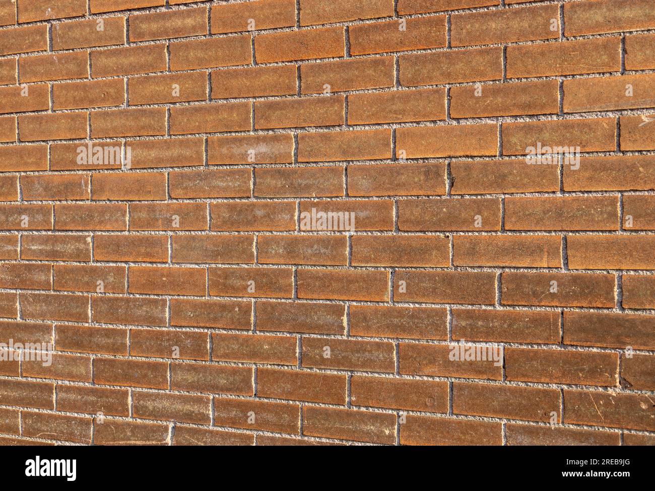 Full frame texture background of a grungy antique orangish brown brick ...
