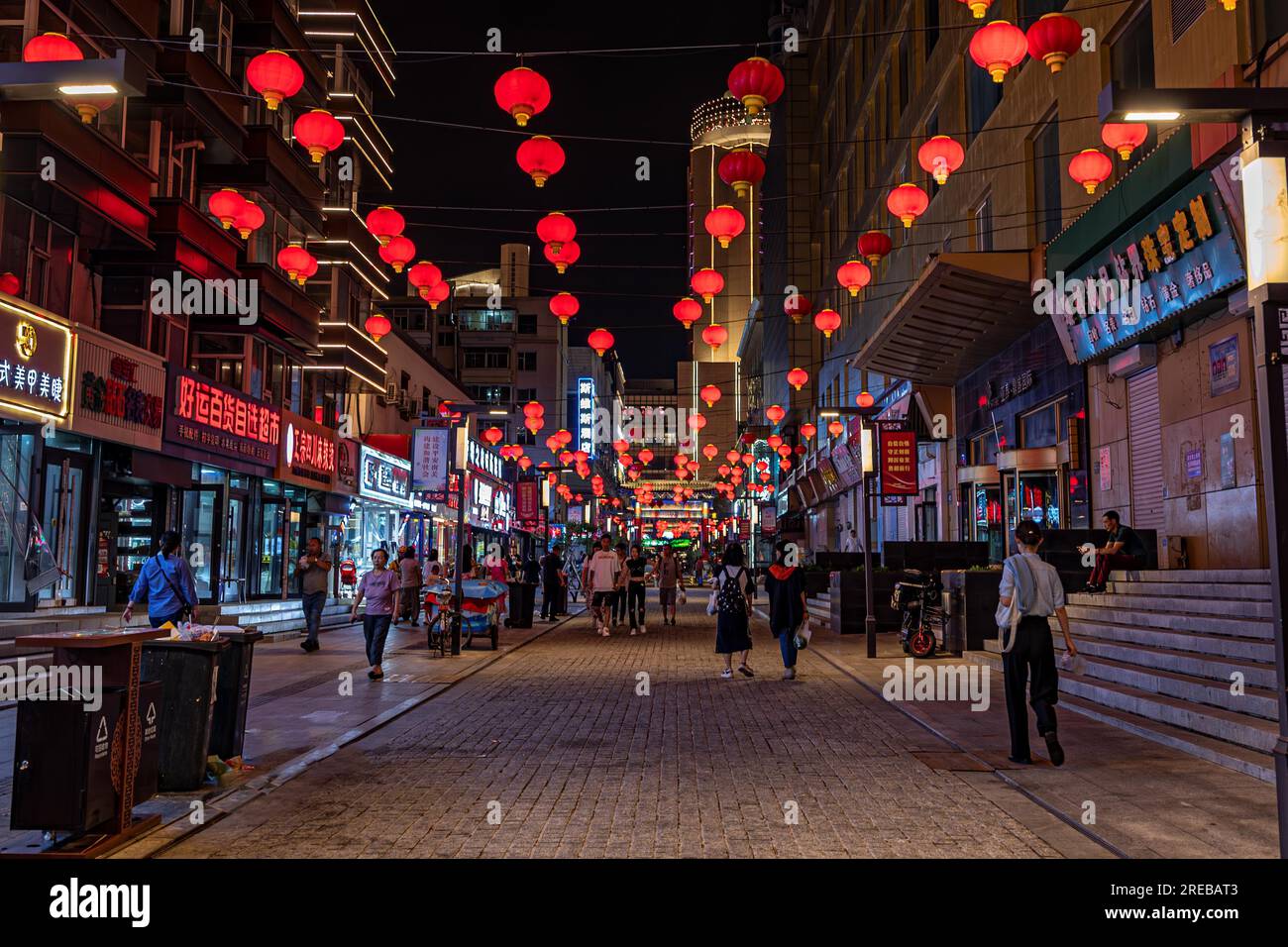 People visit the Chongqing hutong street at night in Changchun City ...