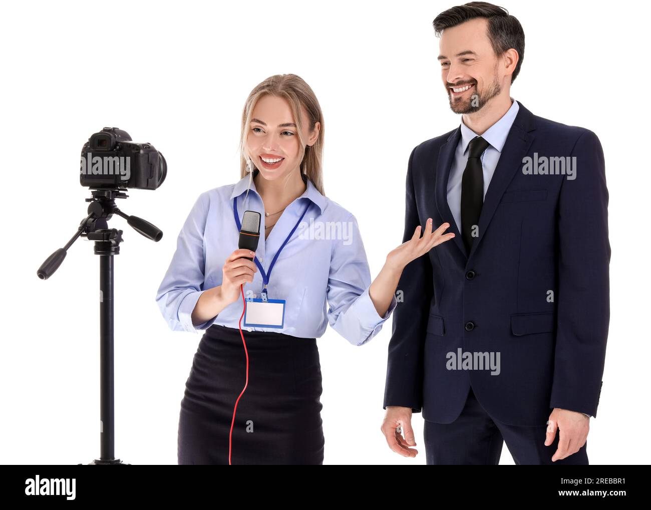 Female journalist with microphone having an interview with businessman ...