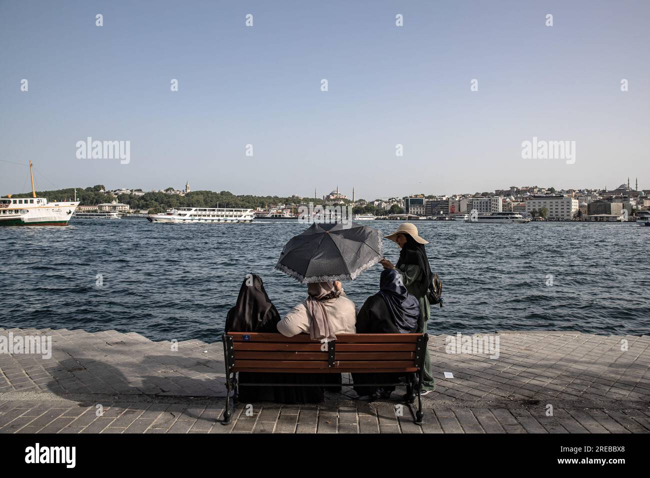 Istanbul, Turkey. 26th July, 2023. A group of tourists seen sitting on ...