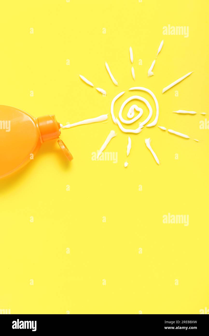 Drawing of sun made with sunscreen cream on yellow background Stock ...