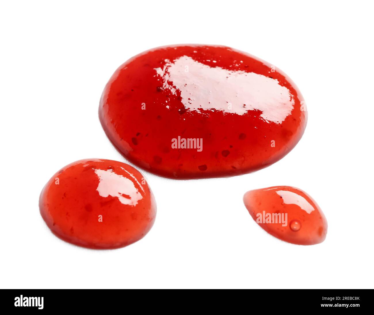 Drops of sweet strawberry jam on white background Stock Photo - Alamy