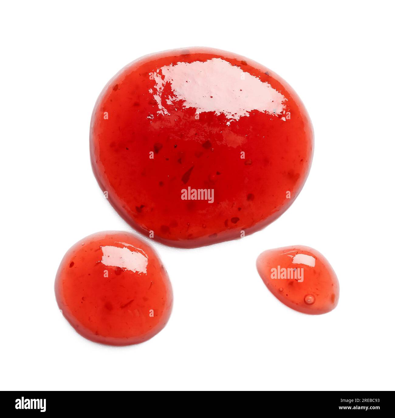 Drops of sweet strawberry jam on white background Stock Photo - Alamy