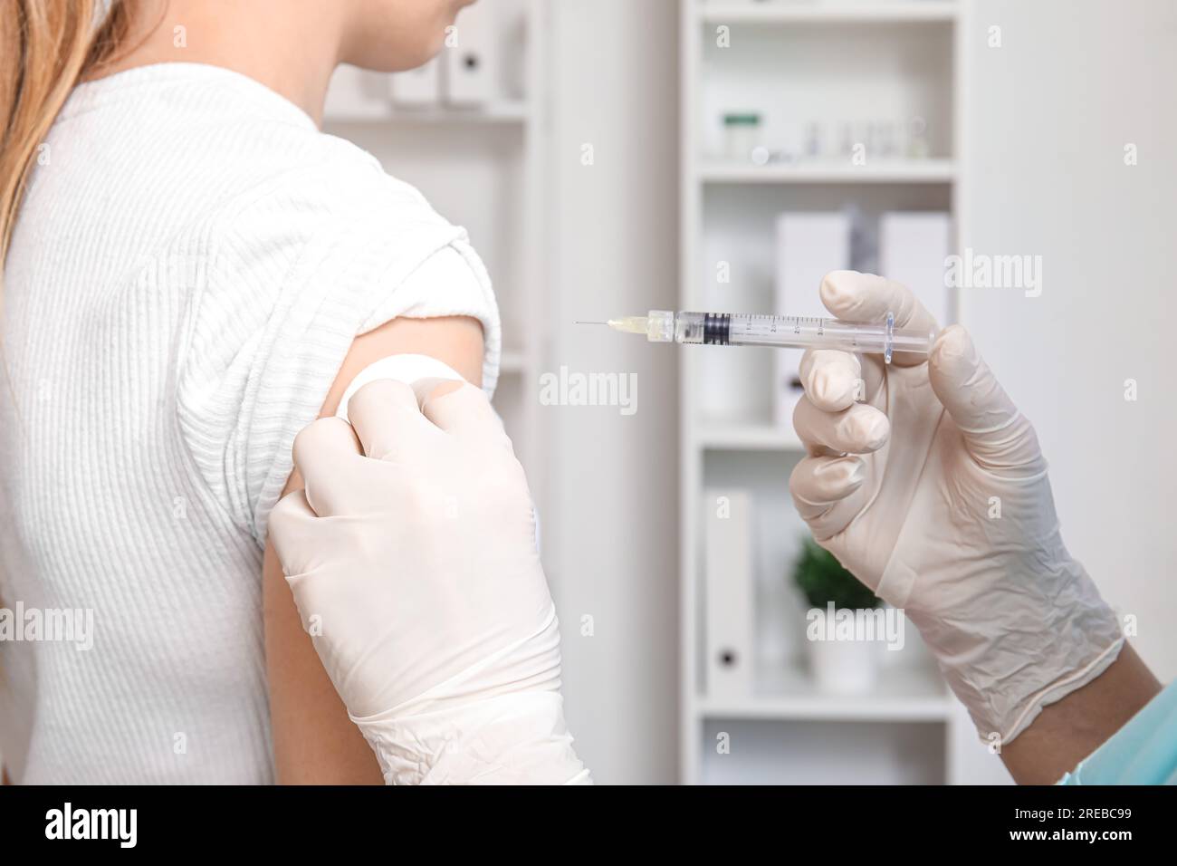 Female doctor giving patient injection in clinic, closeup Stock Photo ...
