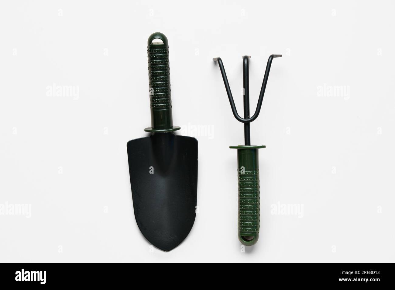 Gardening rake and shovel on white background Stock Photo - Alamy