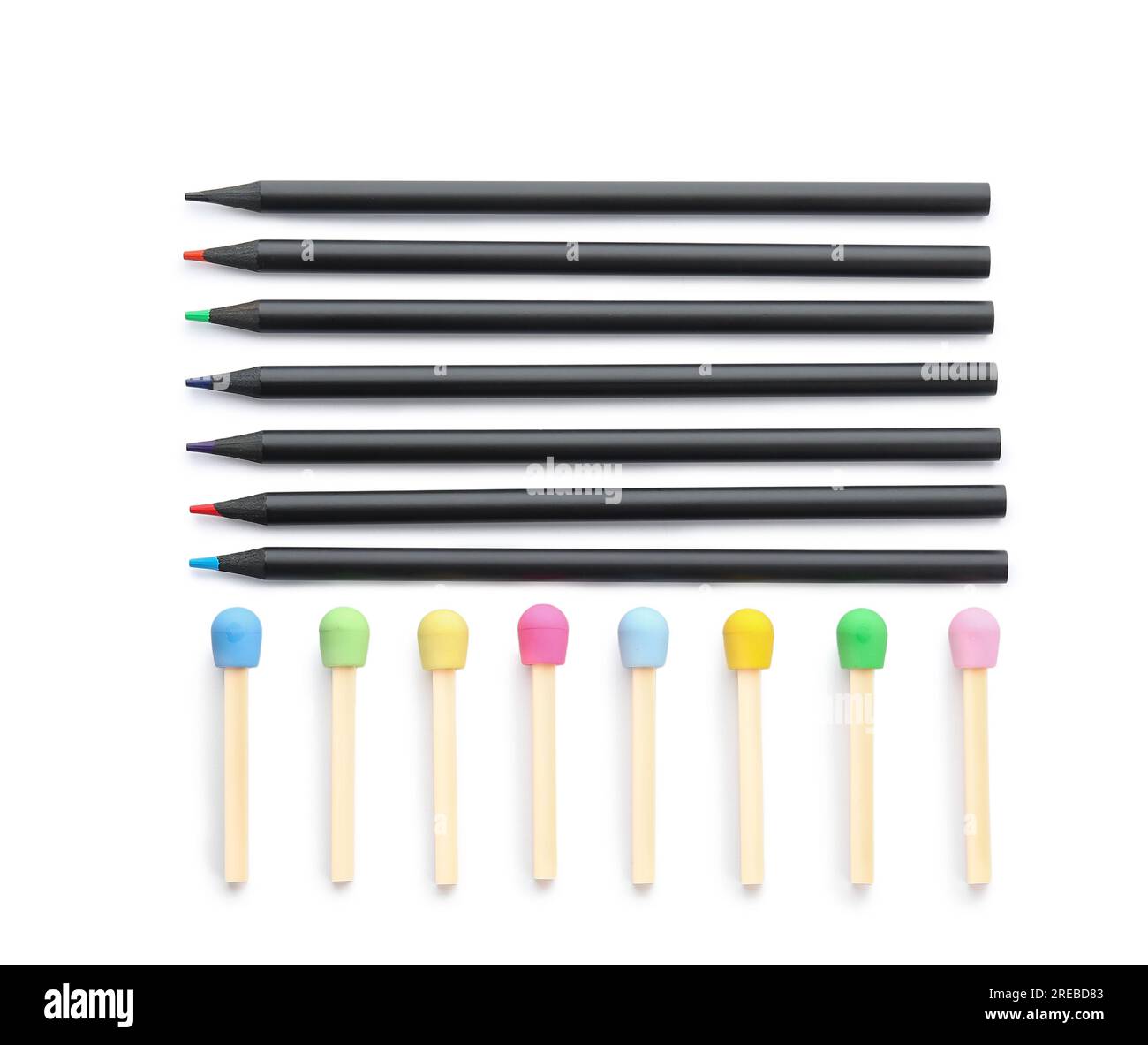 Colorful pencils and erasers in shape of matches on white background ...