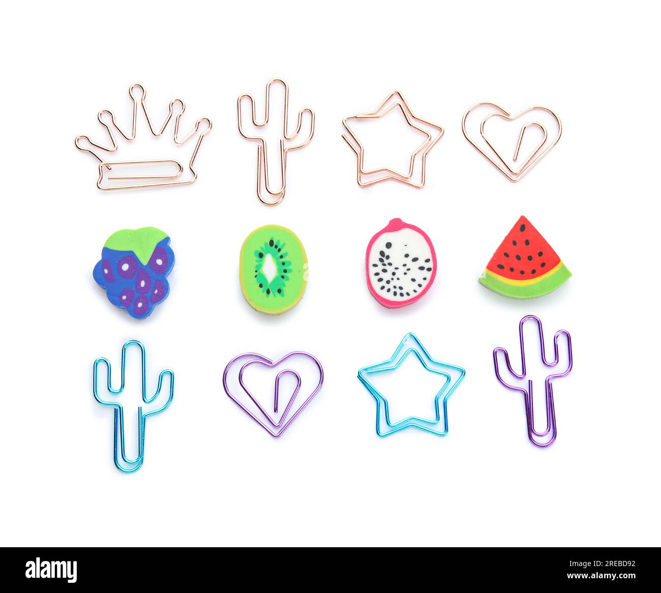 Colorful paper clips and erasers in different shapes on white ...