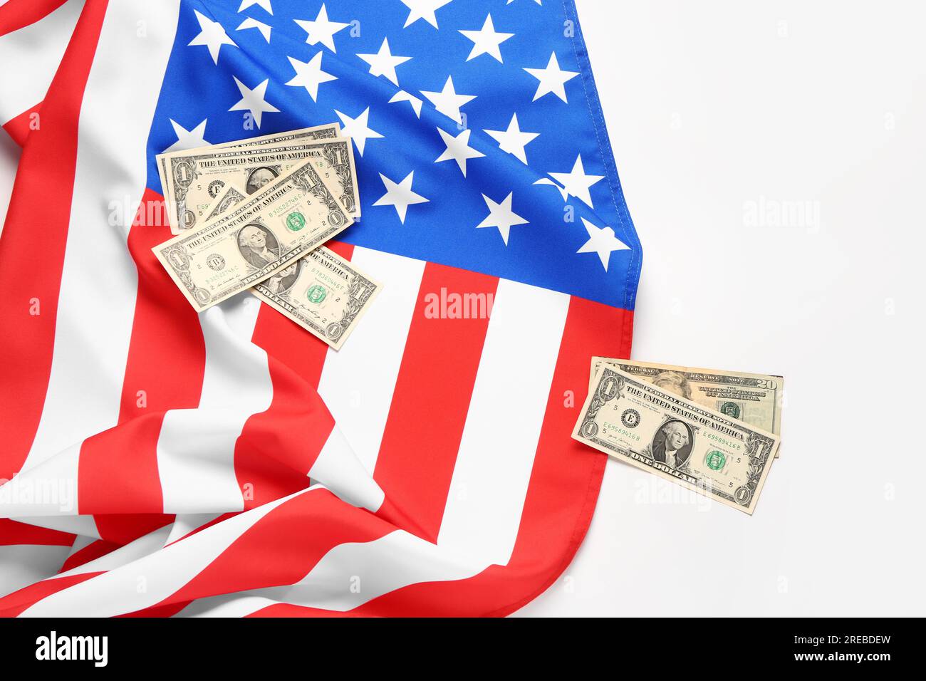 Flag of USA and dollar banknotes on white background Stock Photo - Alamy